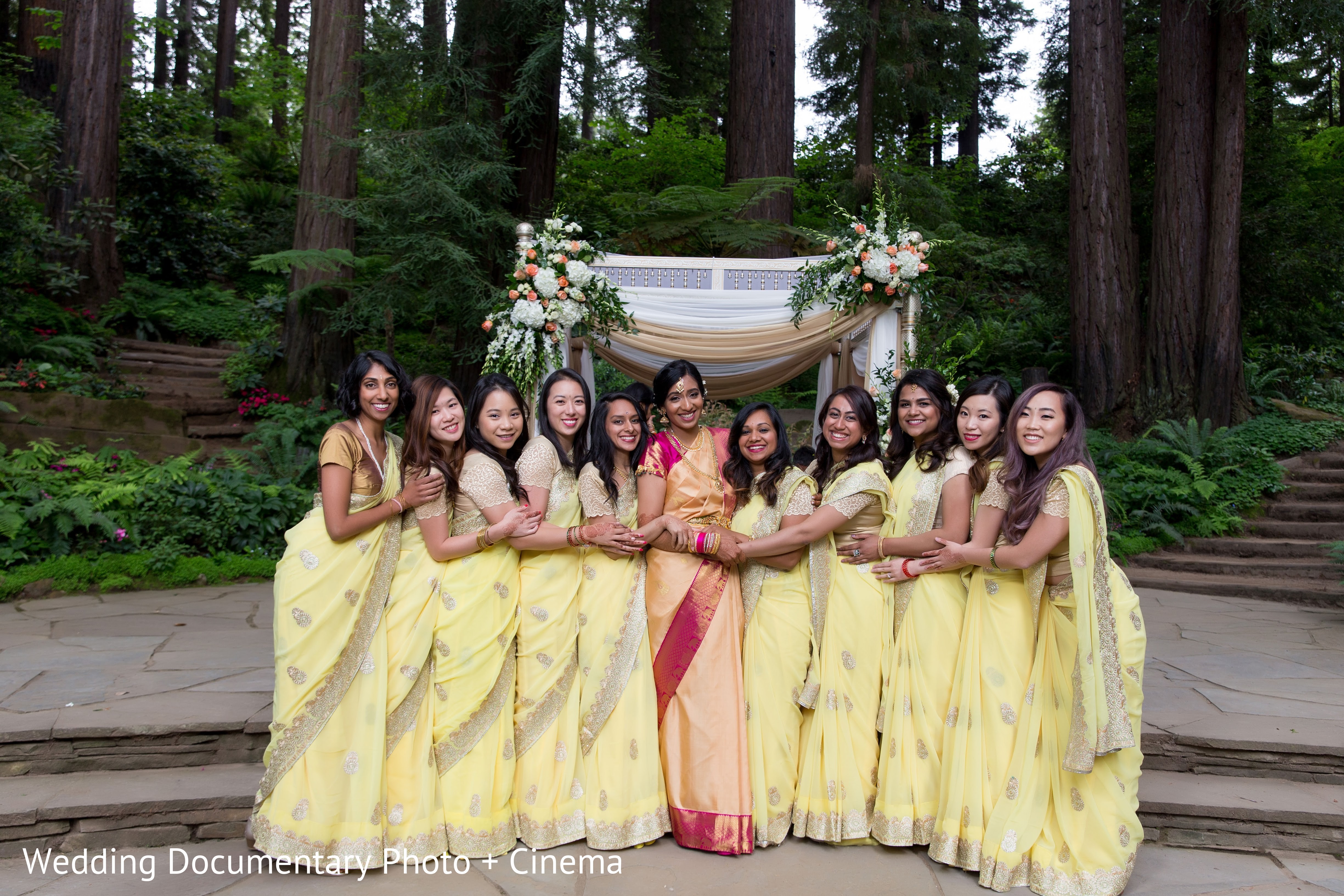 Indian bride and bridesmaids posing with their ceremony outfits ...