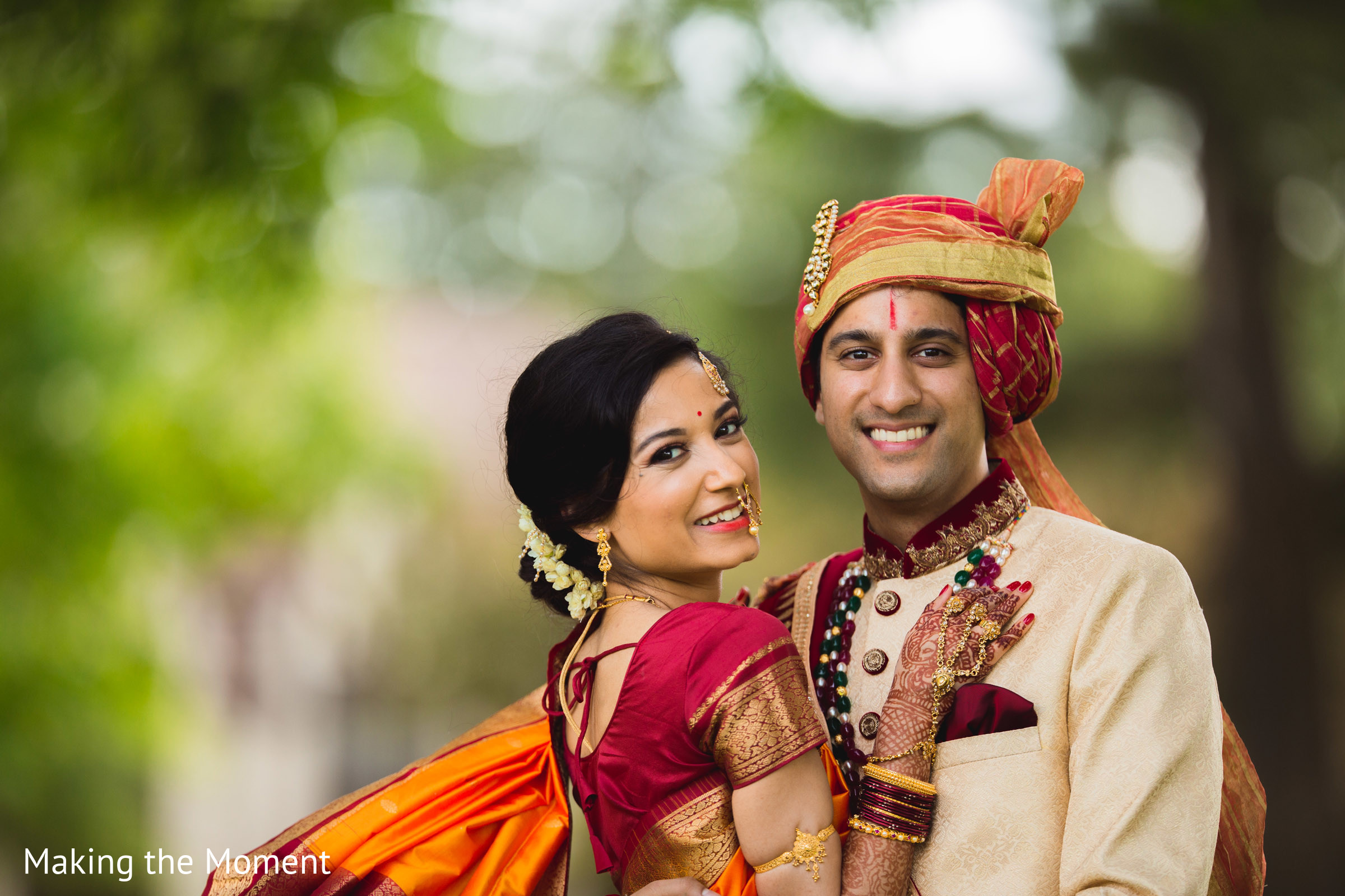 Gorgeous Indian bride and groom looking at camera capture. | Photo 170418
