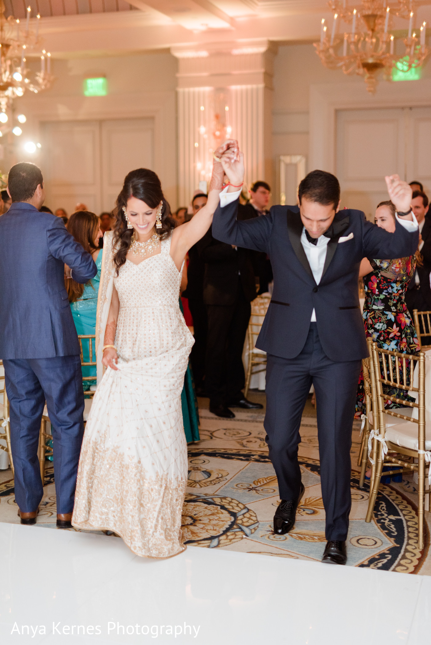 Lovely Indian bride and groom walking in to the dance floor. | Photo 171333