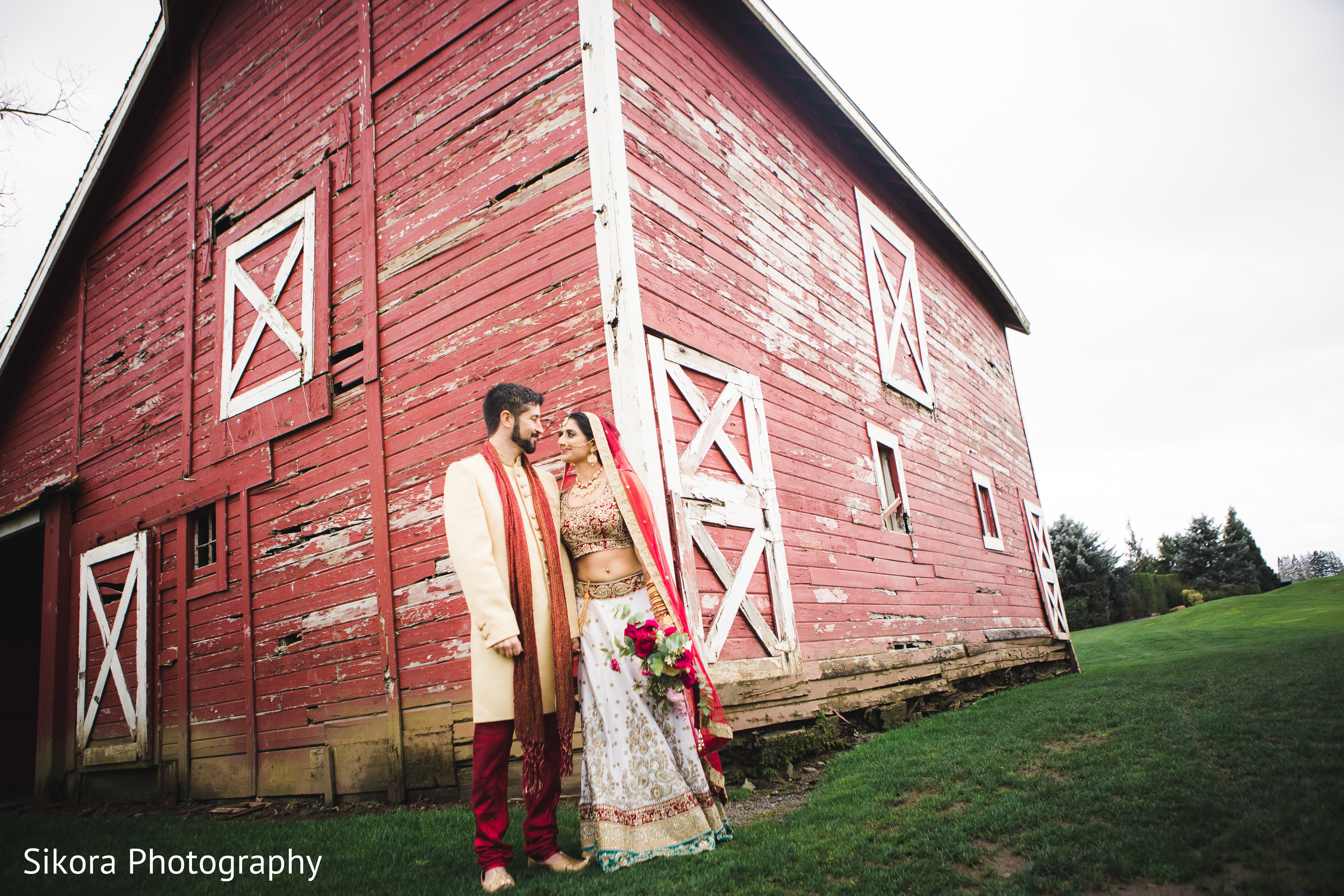 Lovely Indian couple walking outdoors on their wedding traditional ...