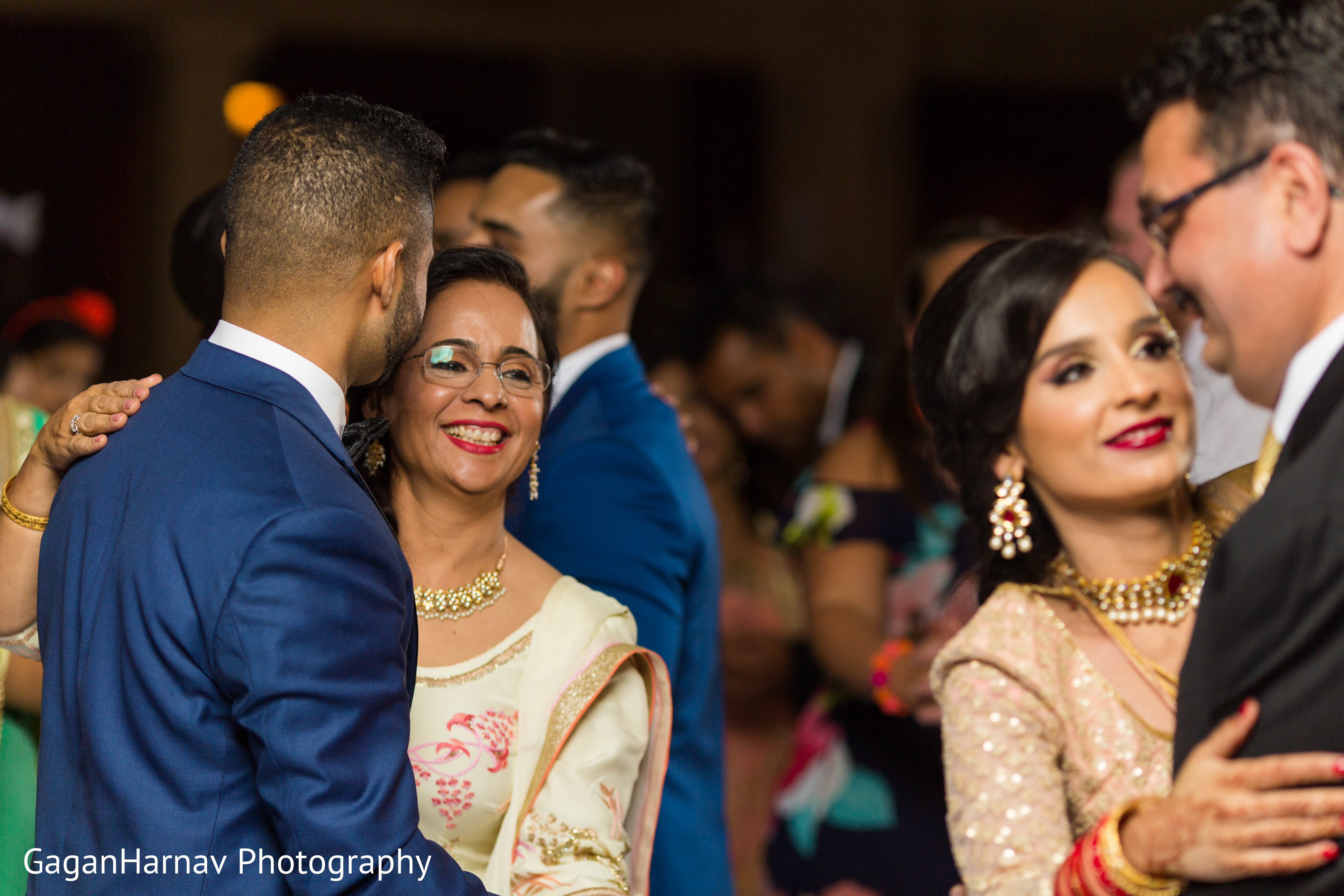 Indian bride and groom dancing with guests | Photo 179124
