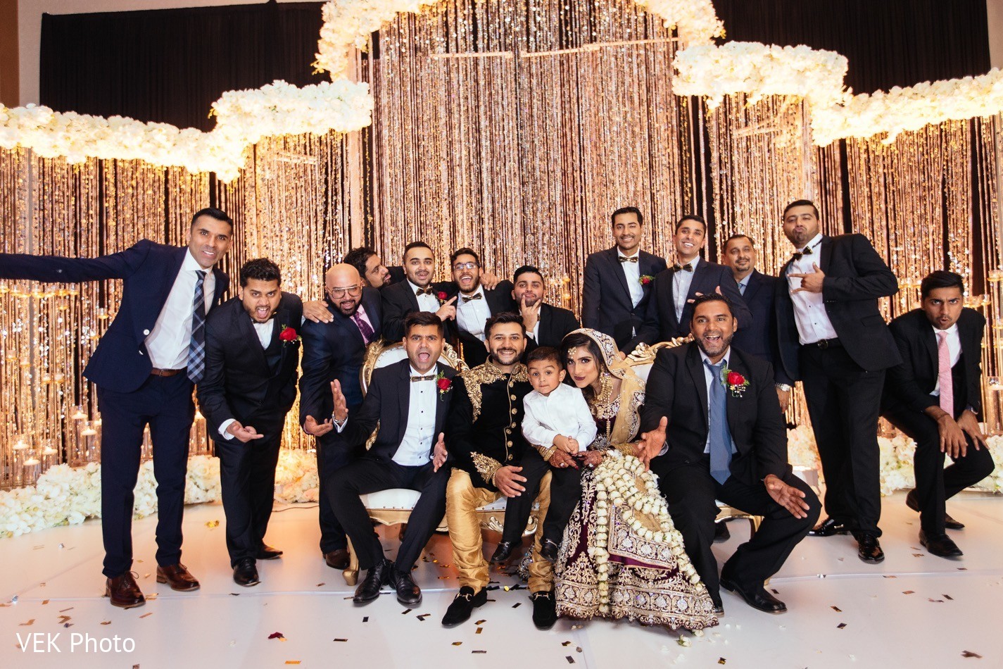 The Indian couple poses with special guests at the reception. | Photo ...