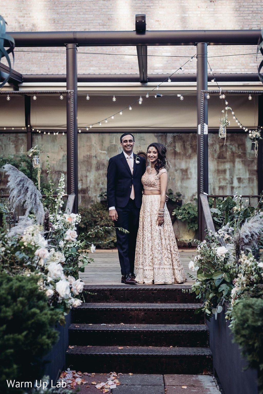 Gorgeous Indian bride and groom entering the wedding reception portrait ...