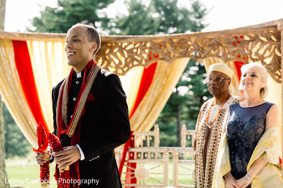 Raja holding the flower garland during the ceremony | Photo 194771