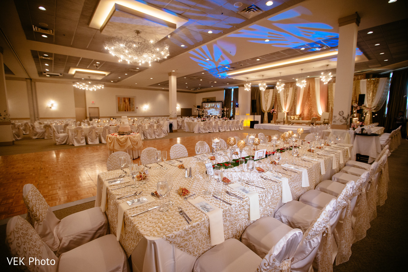 Elegant Indian wedding reception tables, stage and dance floor setup ...