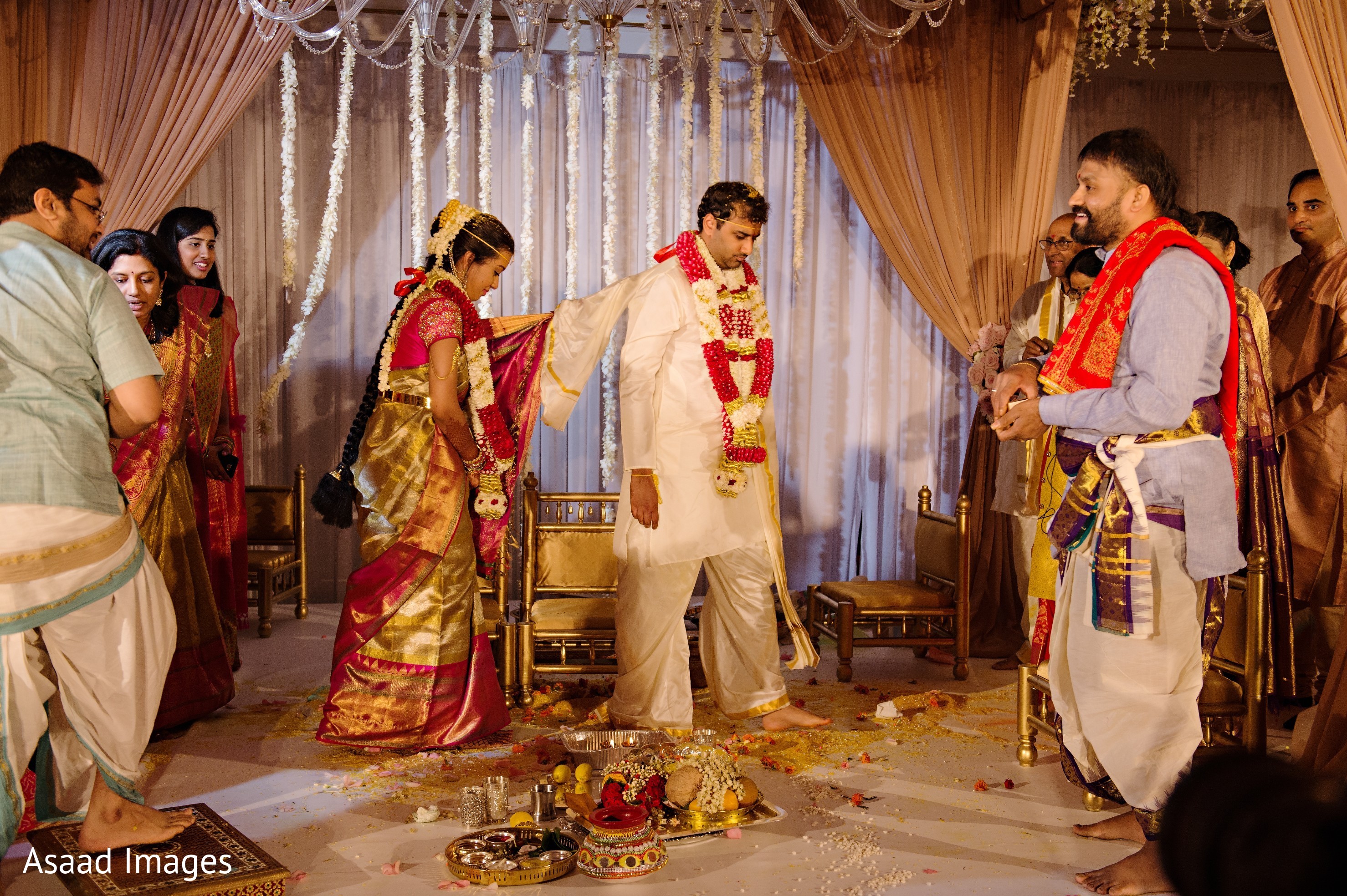 Indian bride and groom take their rounds around the sacred fire ...