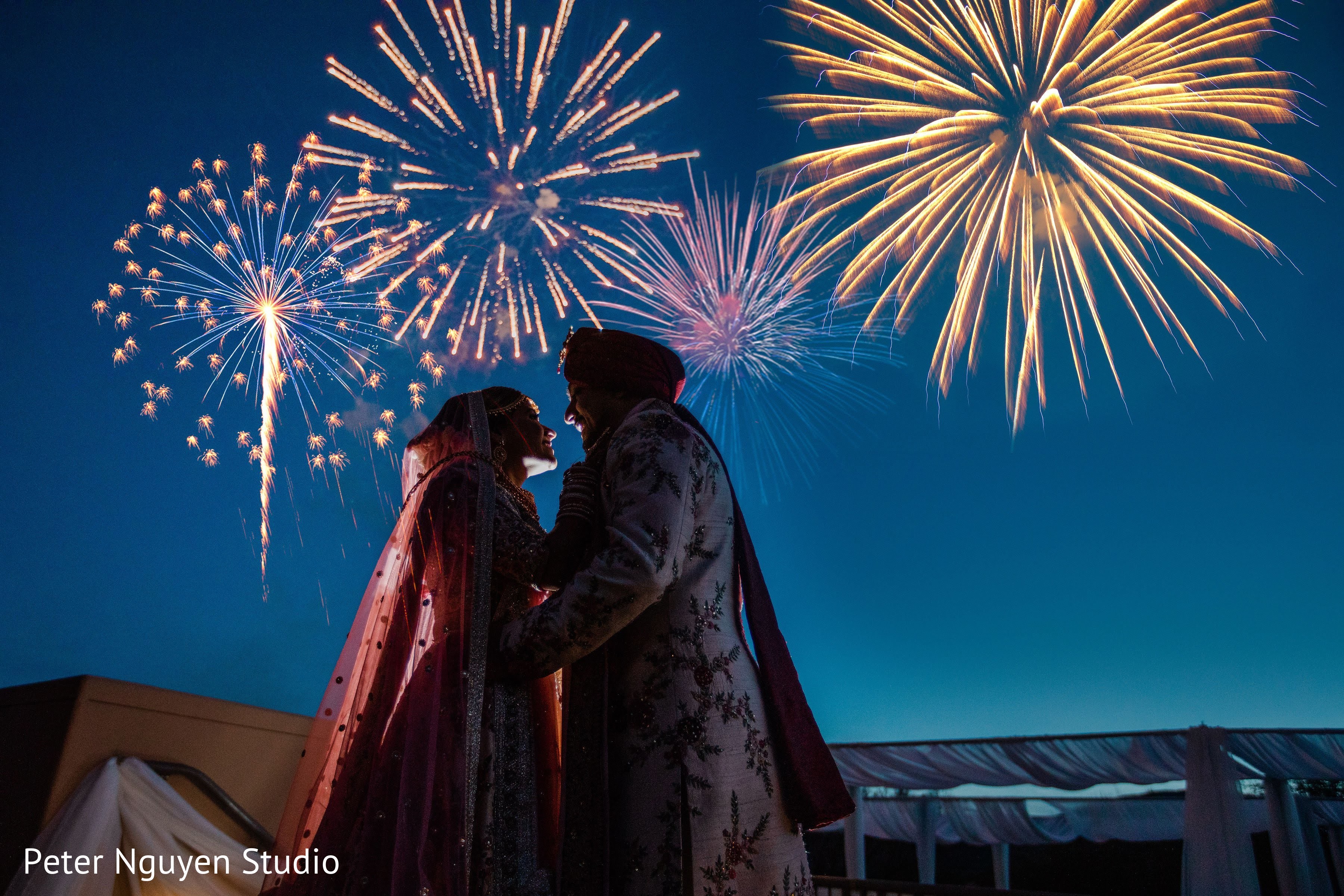 Delightful indian couple next to wedding fireworks photo. | Photo 213393