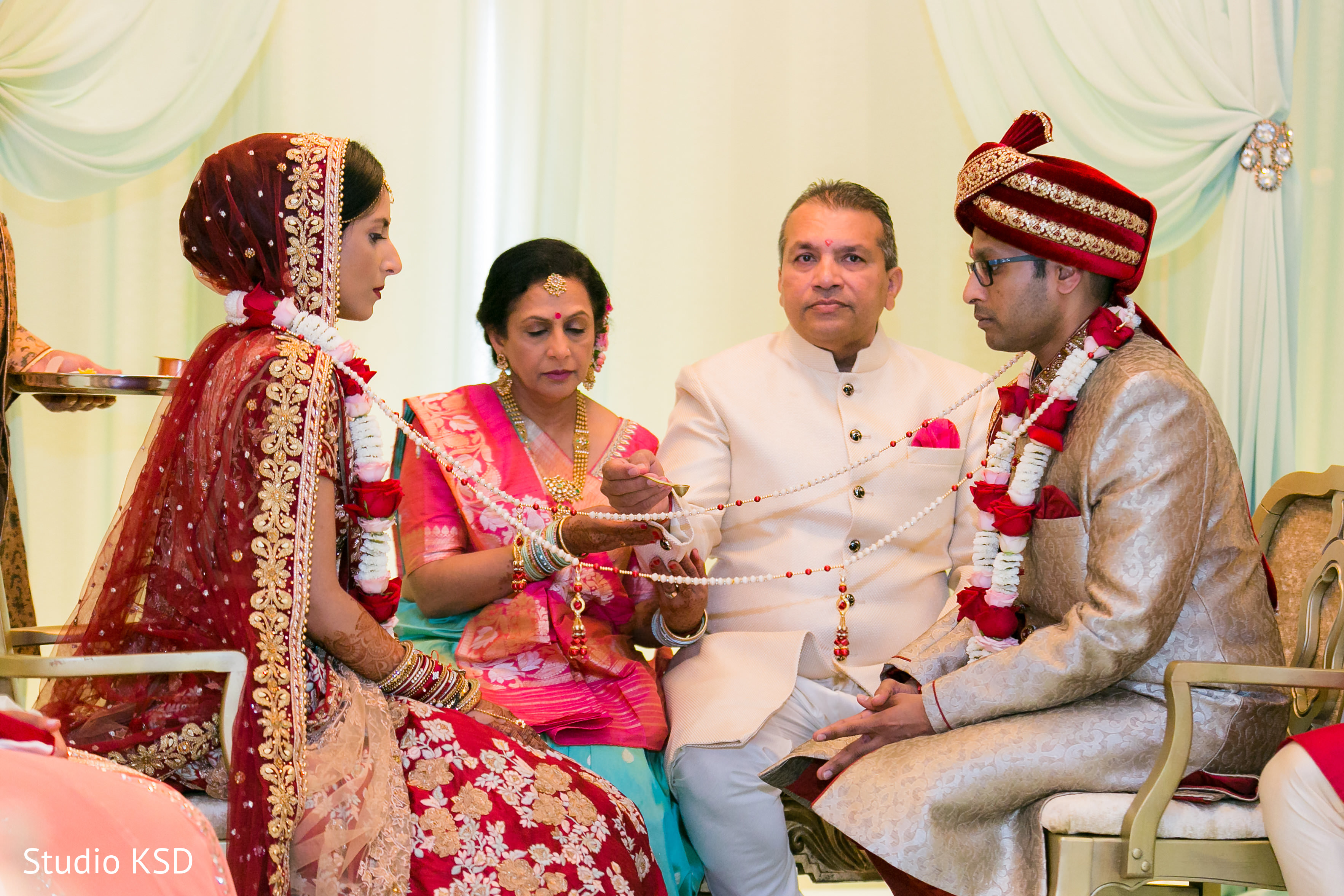 Indian bride and groom with ceremony lasso ritual. | Photo 218996