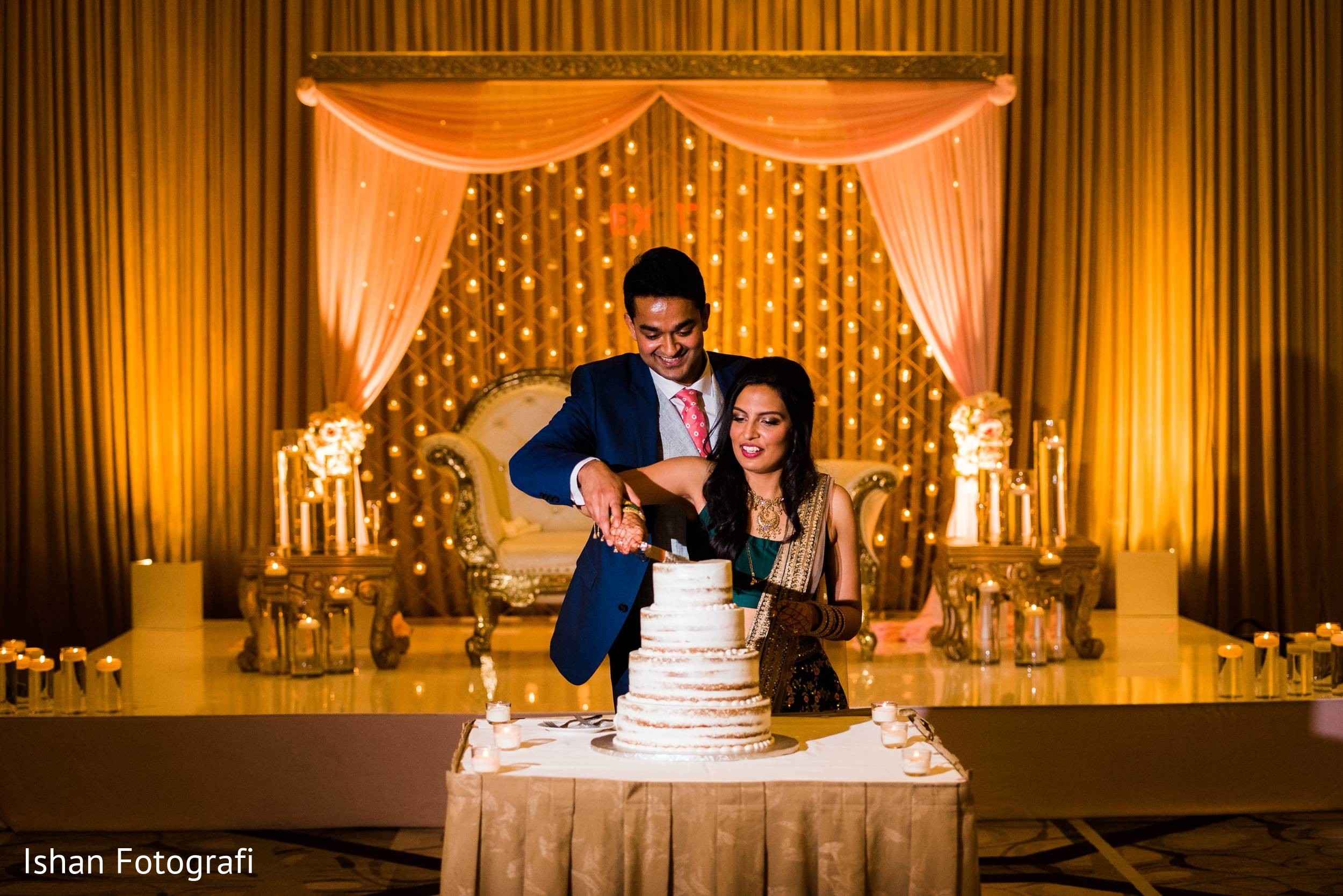 Lovely Indian bride and groom cutting cake together. | Photo 219523