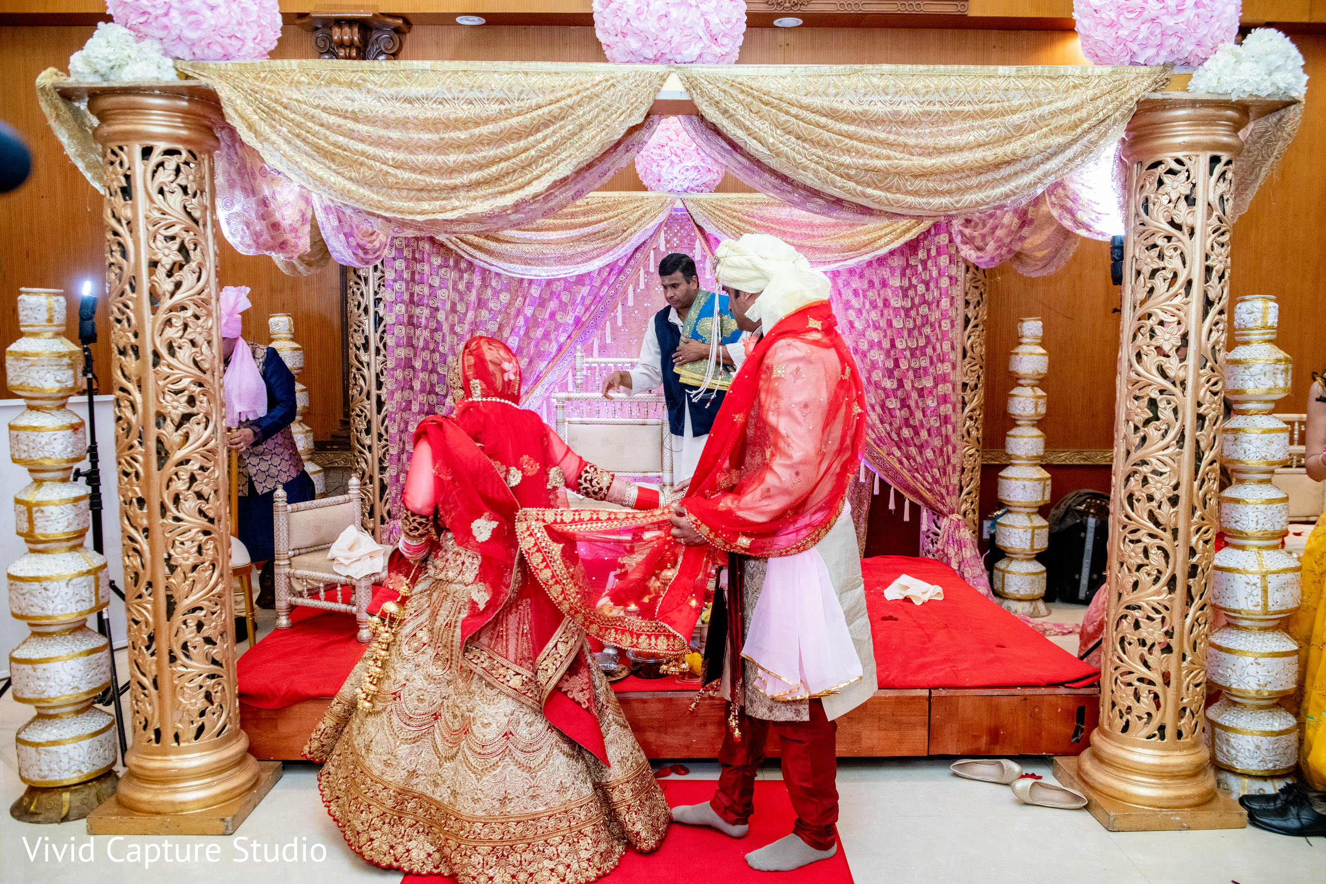 Indian bride and groom under the mandap | Photo 225156