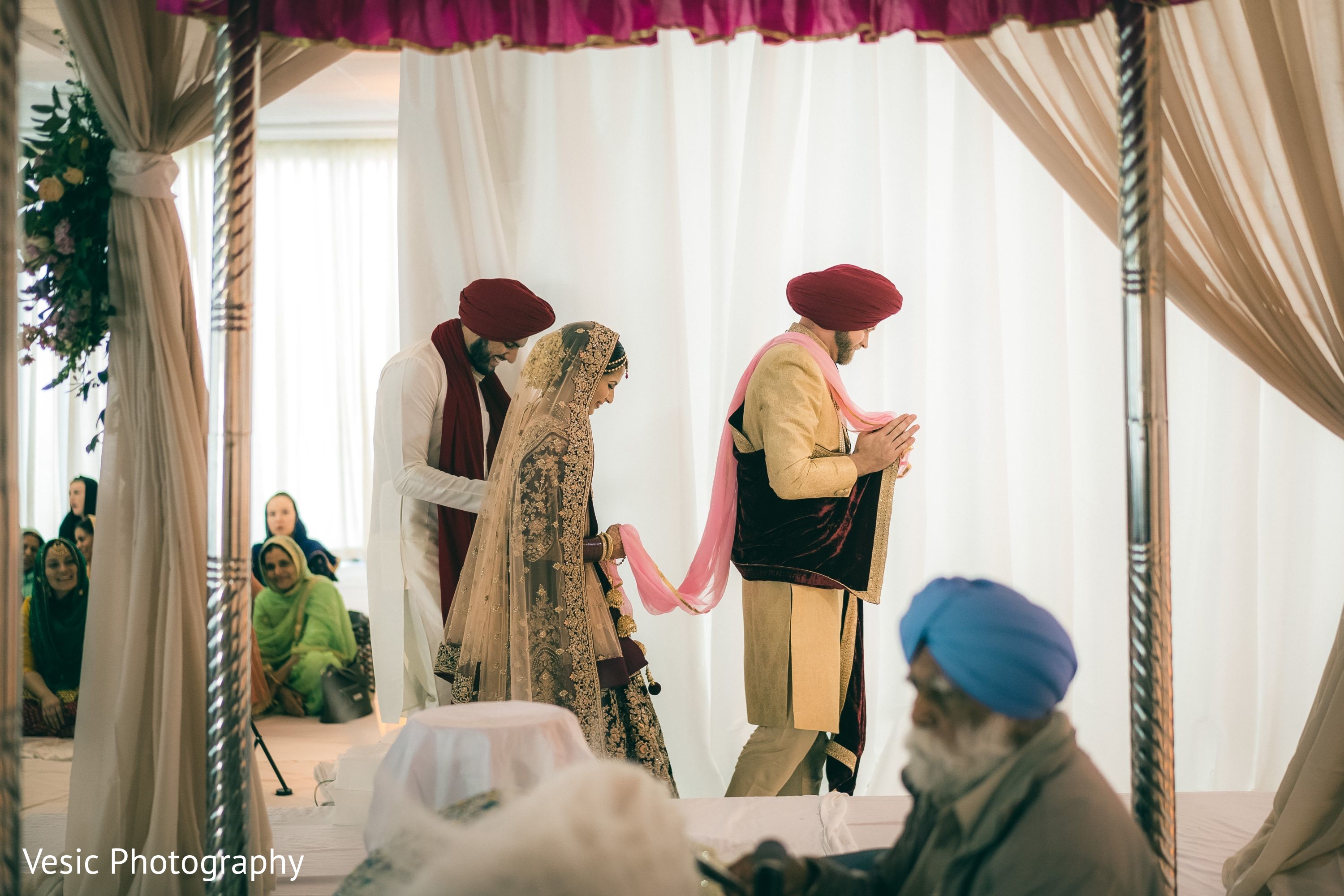 Joyful Indian couple during the seven steps ritual. | Photo 240808