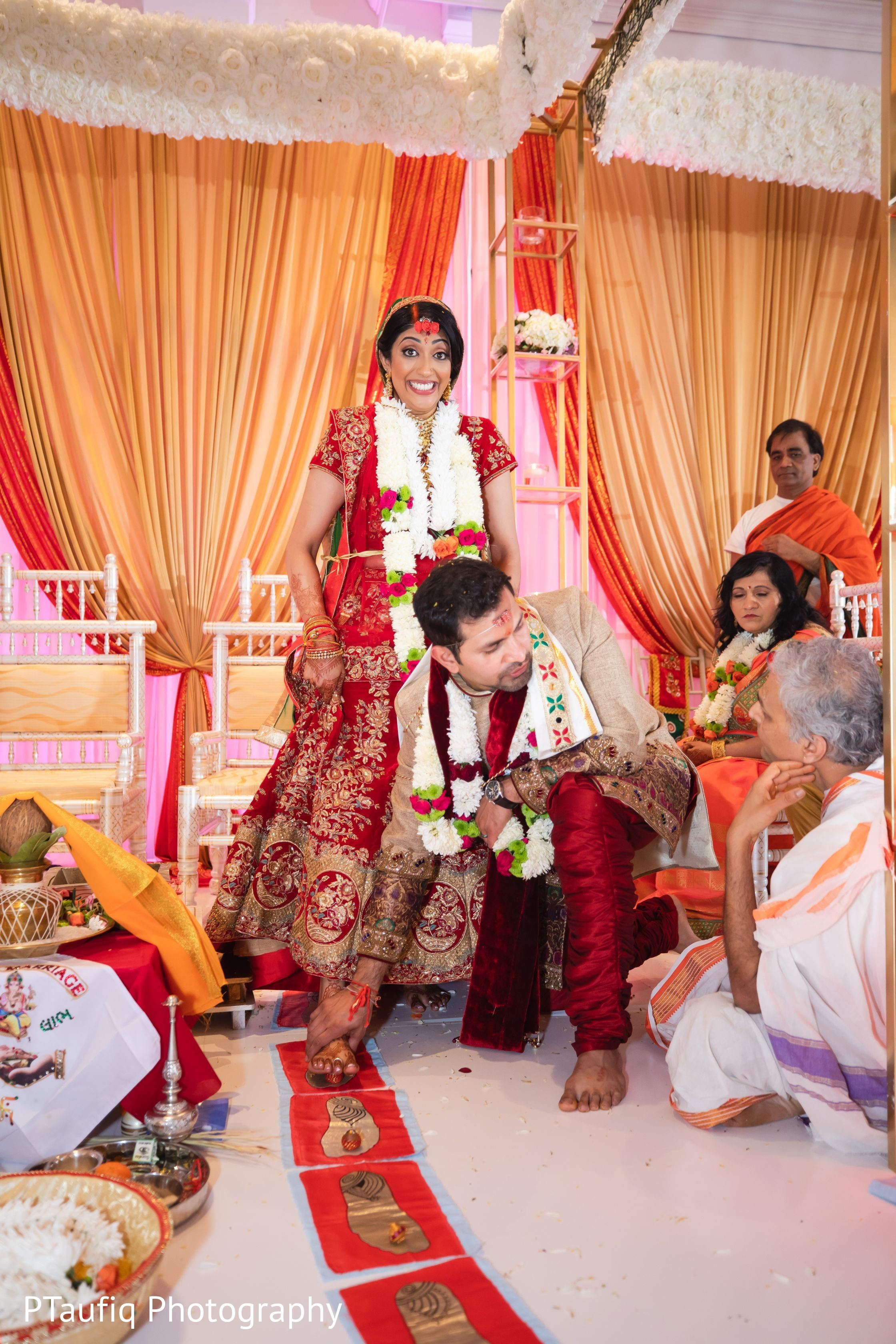 Indian bride stepping on nuts ritual. | Photo 243843