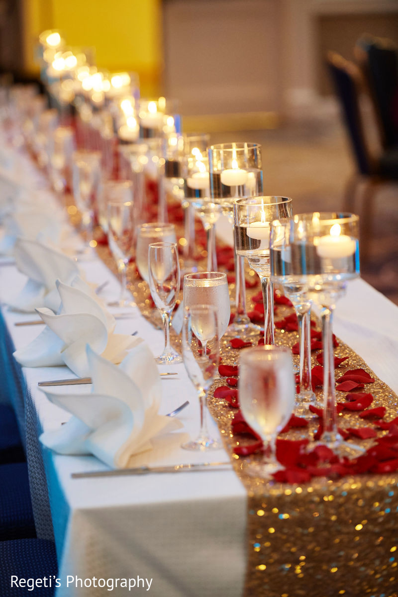 Elegant table decoration with candles and rose petals. | Photo 244955