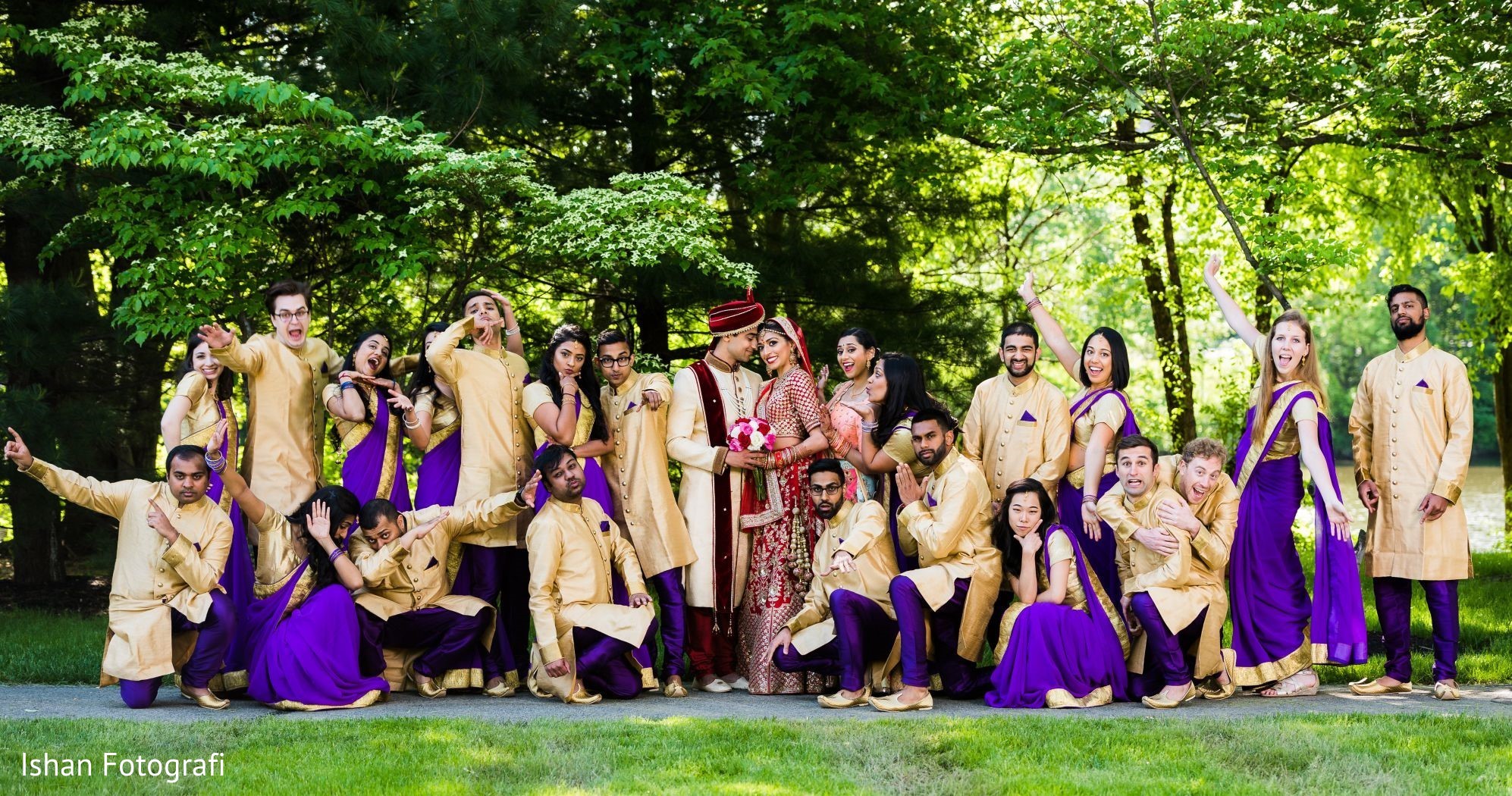 Upbeat indian bride and groom with bridesmaids and groomsmen capture ...