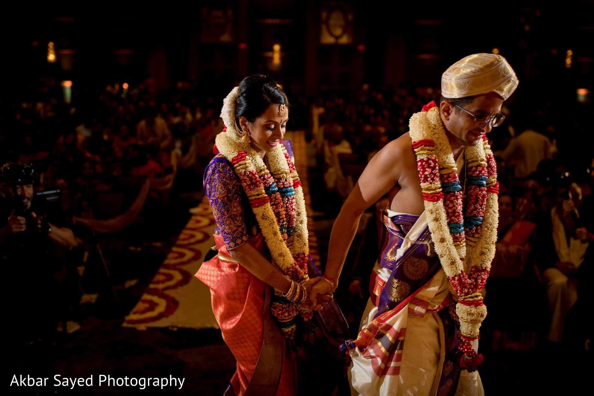 Indian bride and groom walking the seven steps around sacred fire ...