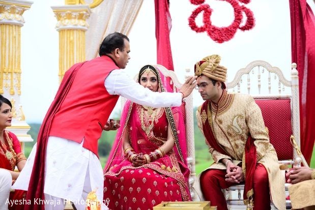 Indian groom getting the red dot on the forehead. | Photo 258263