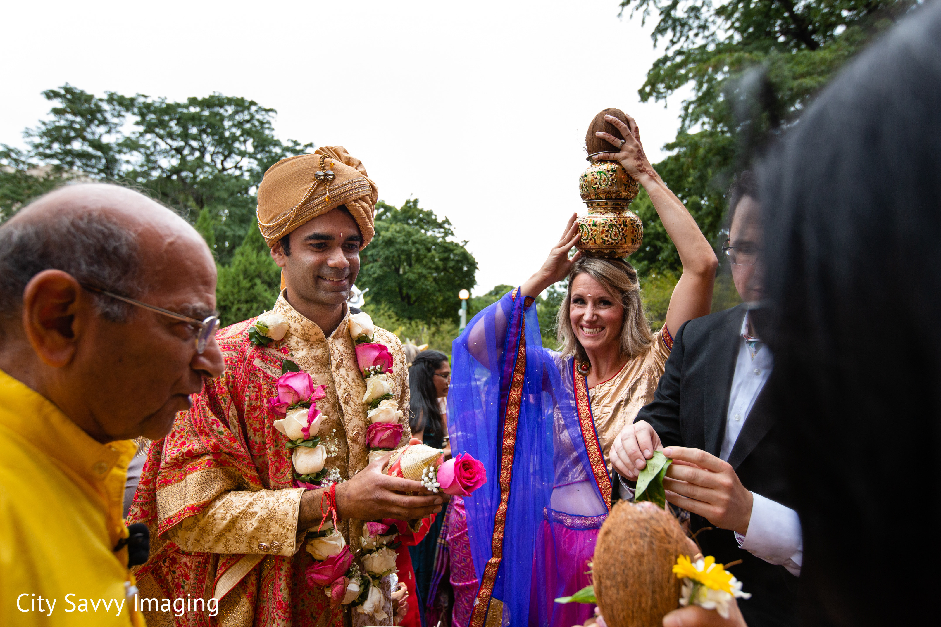 Indian groom with relatives during the coconut pre-wedding rituals ...