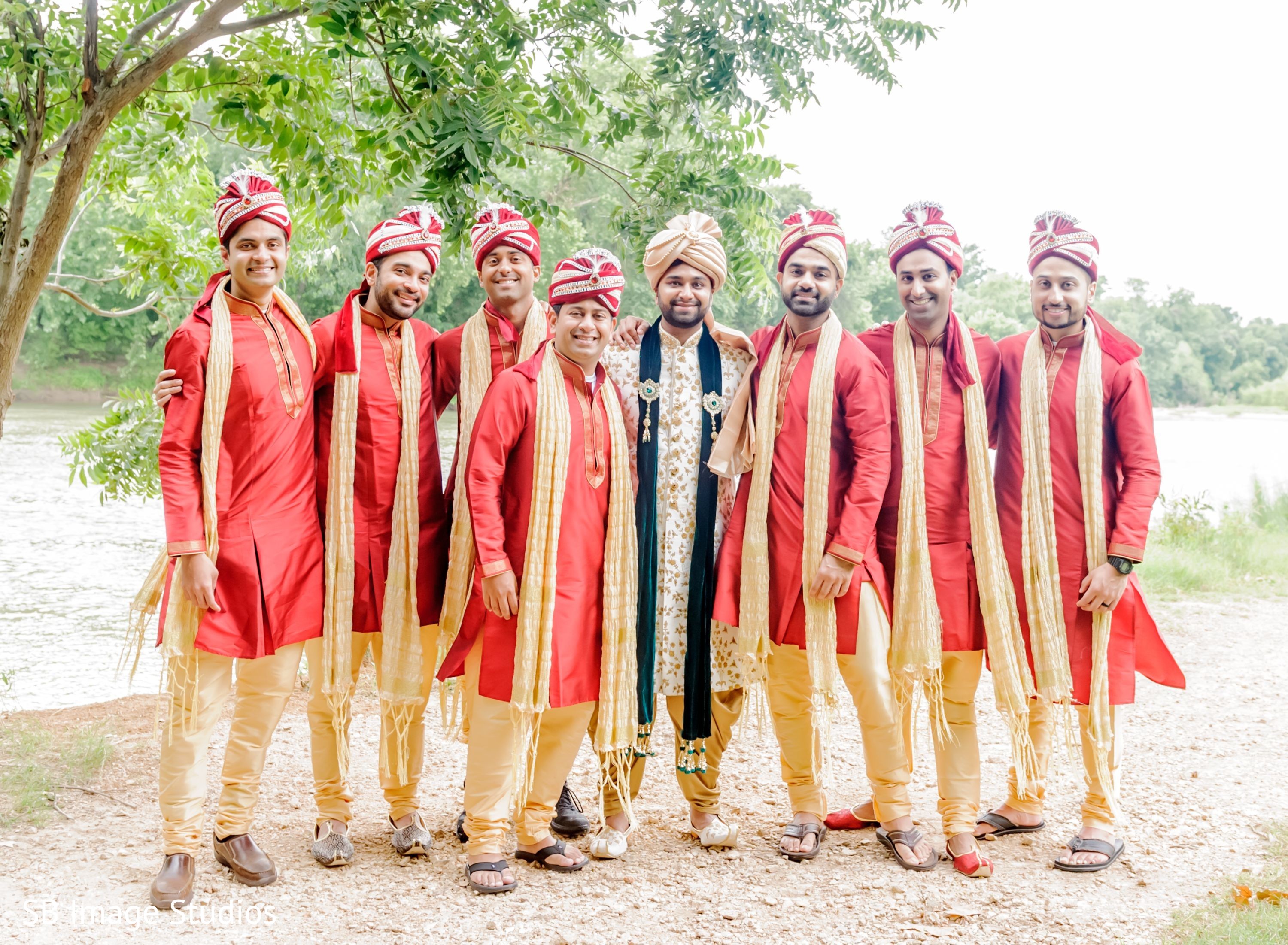 Indian groom with his groomsmen on their red ceremony outfits. | Photo ...