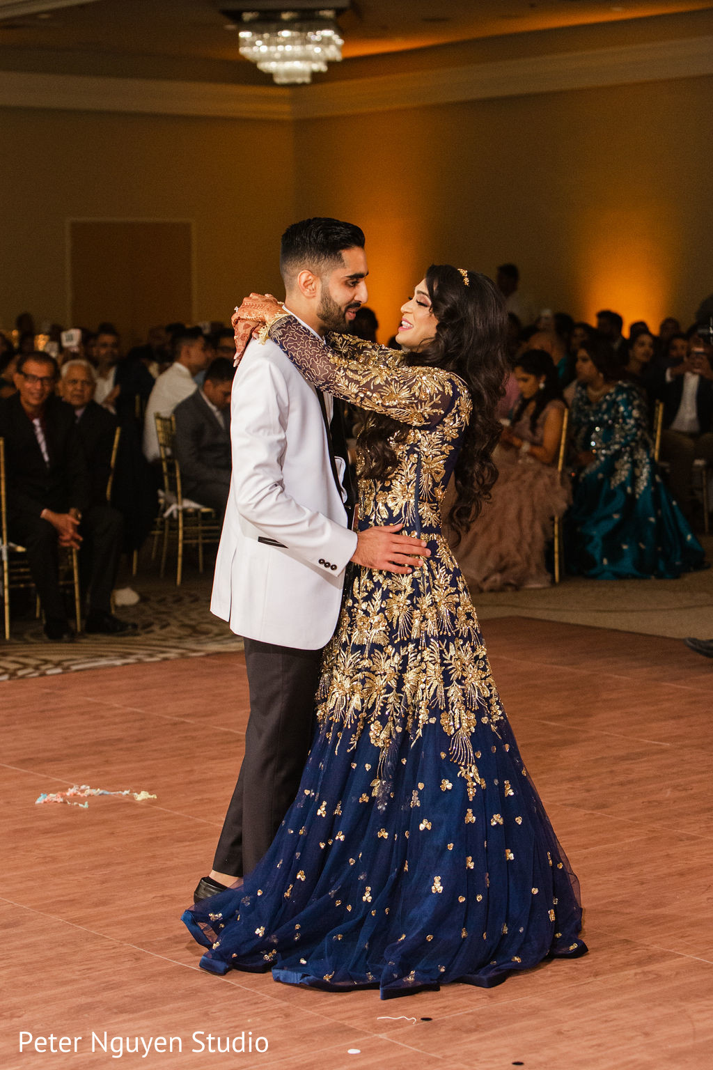 Indian bride and groom dancing together for their first time. | Photo ...
