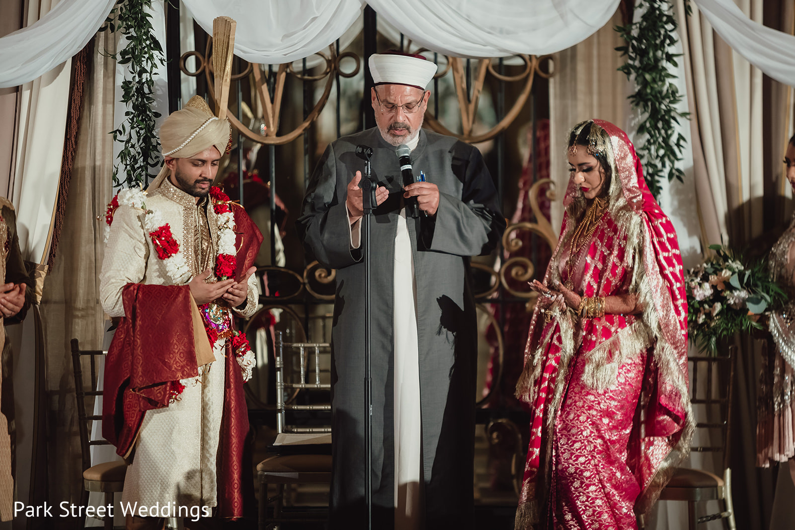 Indian groom and Indian bride elevating a prayer | Photo 264995