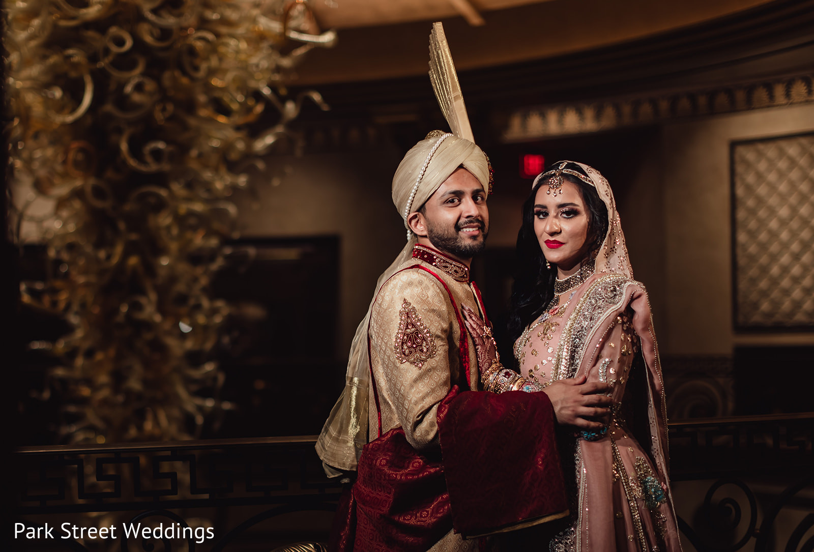 Indian newlyweds posing by a railing | Photo 265000