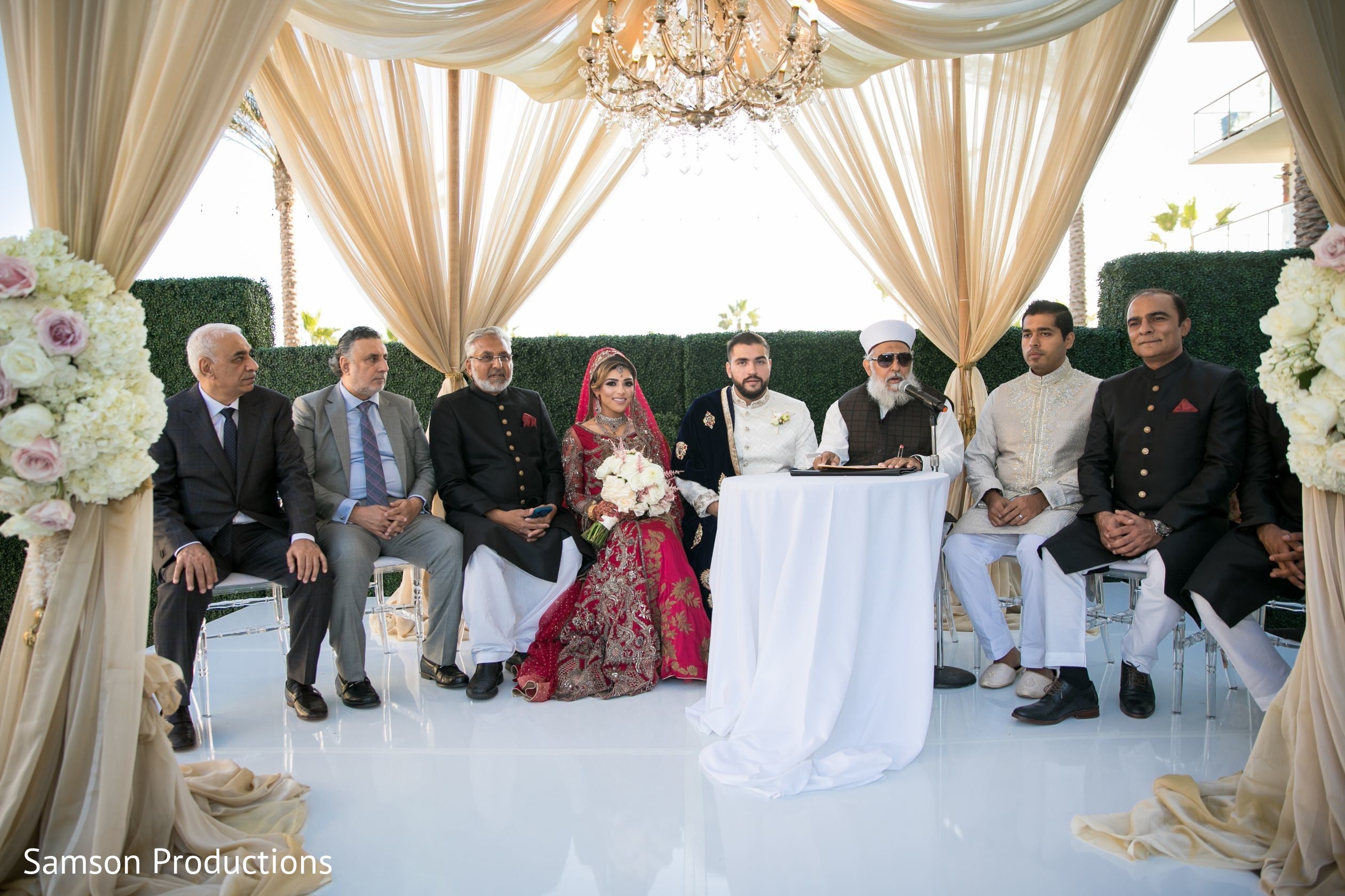 Maharani and her Indian groom sitting on the wedding stage | Photo 265738