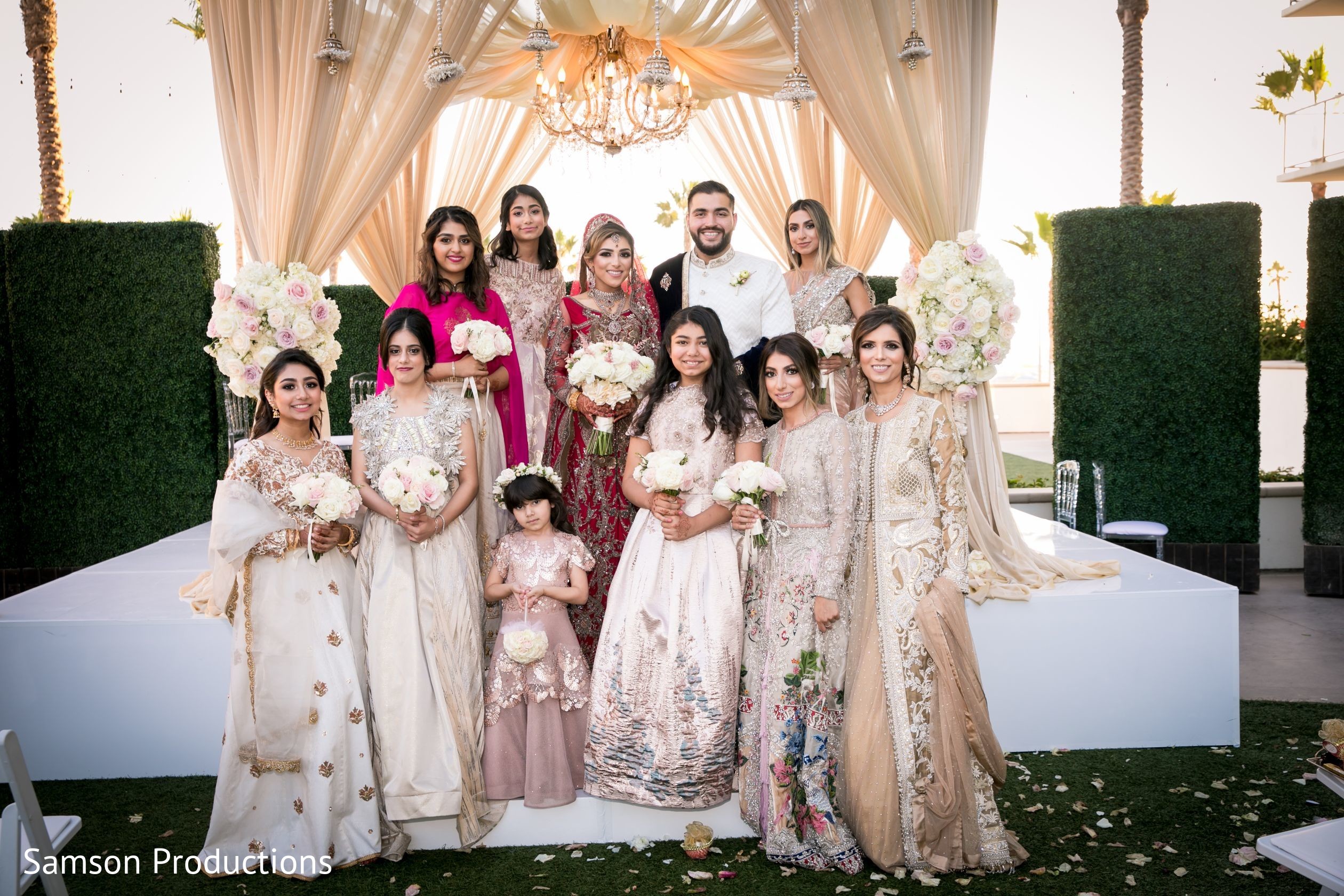 Indian newlywed couple and female Indian relatives on stage | Photo 265753