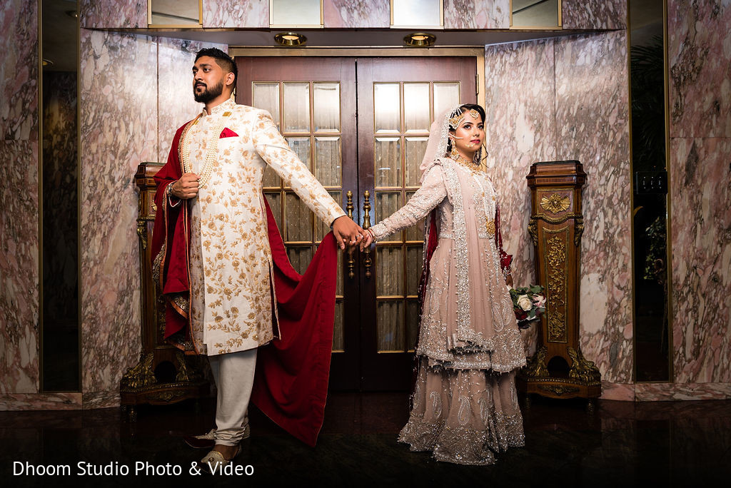 Indian couple, in their wedding attires, holding hands | Photo 269700