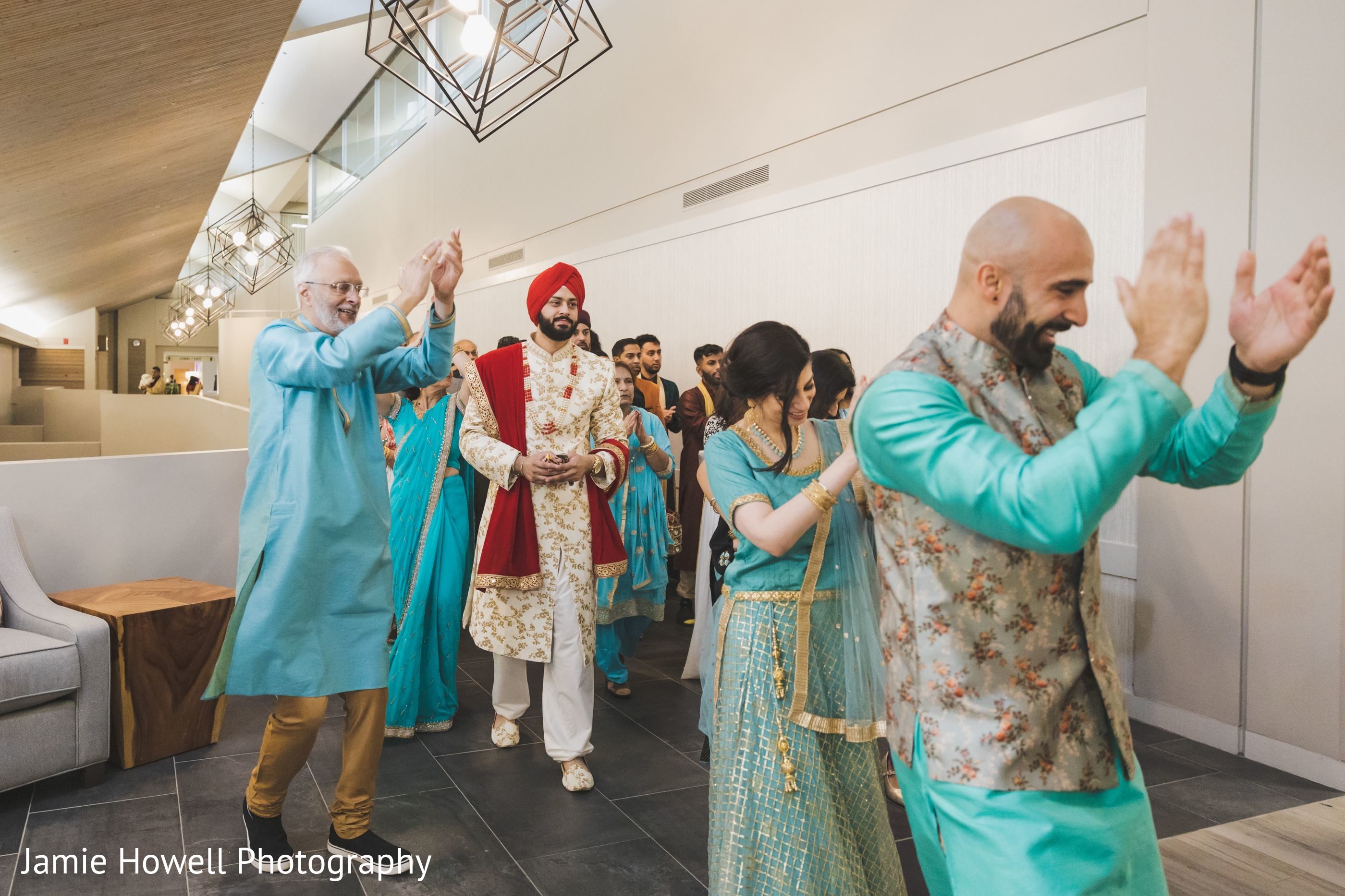 The Indian groom's entourage making their entrance to the venue | Photo ...