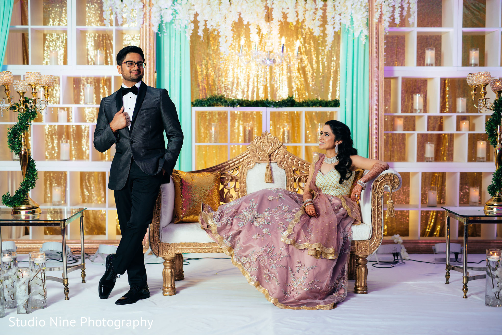 Indian bride and groom posing at wedding reception stage. | Photo 296174