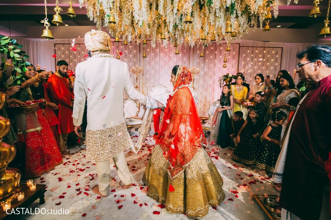 Indian couple walking the seven steps around the sacred fire. | Photo ...