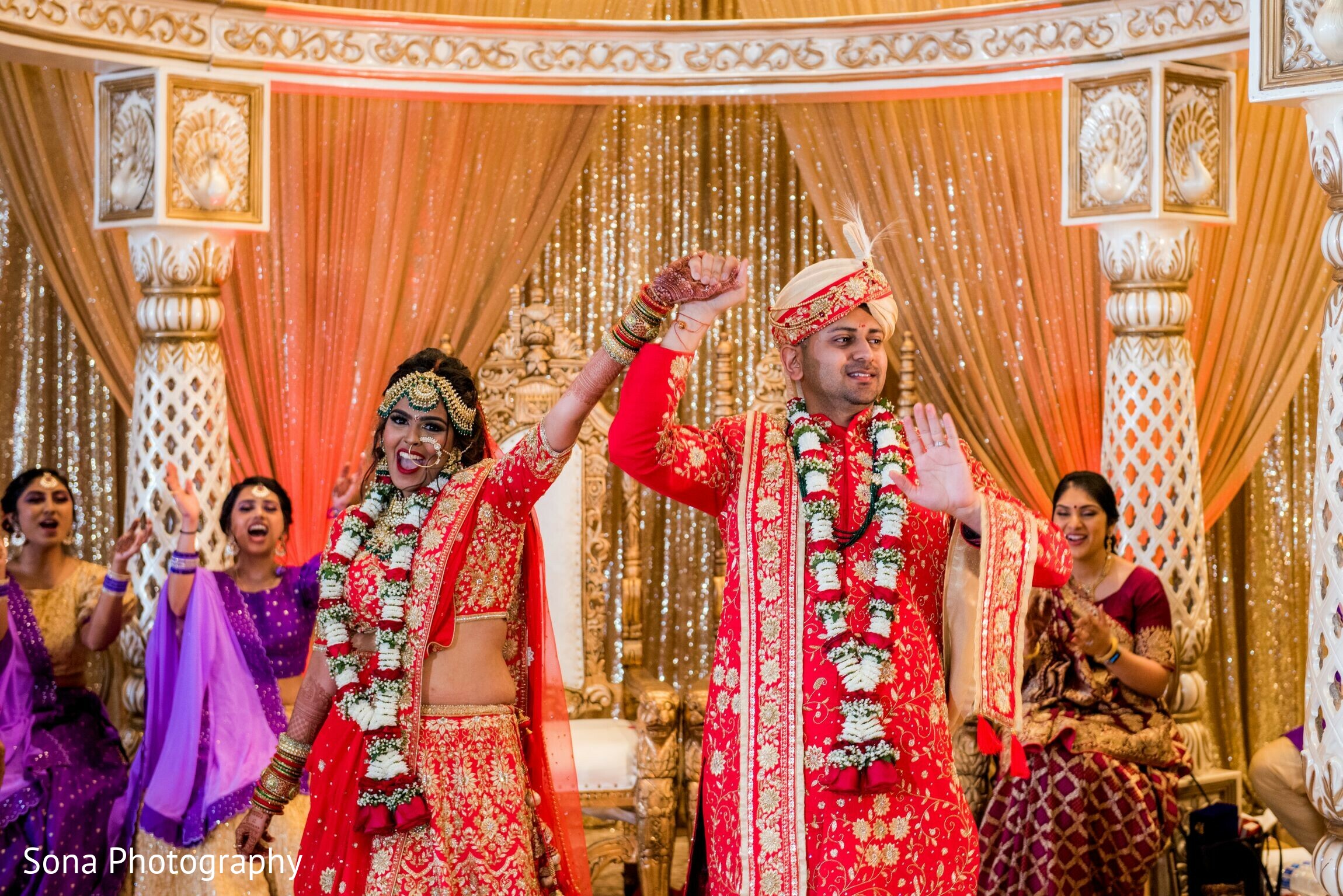 Joyful Indian bride and groom holding hands capture. | Photo 325669