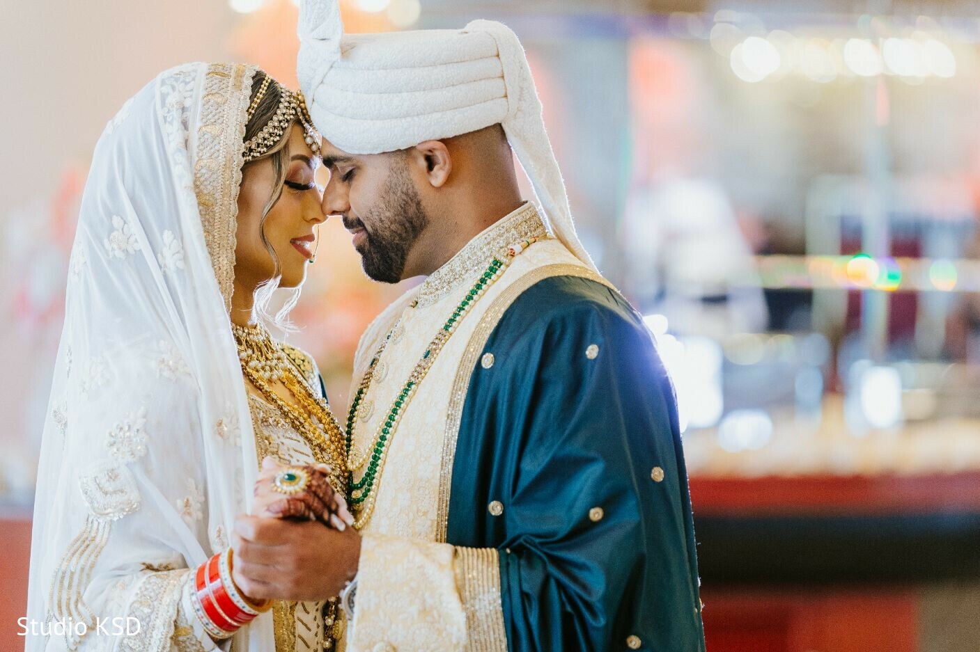Joyful Indian bride and groom holding hands capture. | Photo 326533