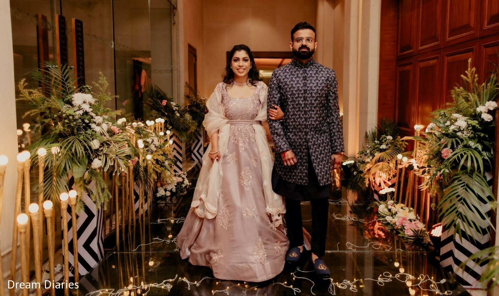 Elegant Indian bride and groom's entrance to wedding reception capture ...