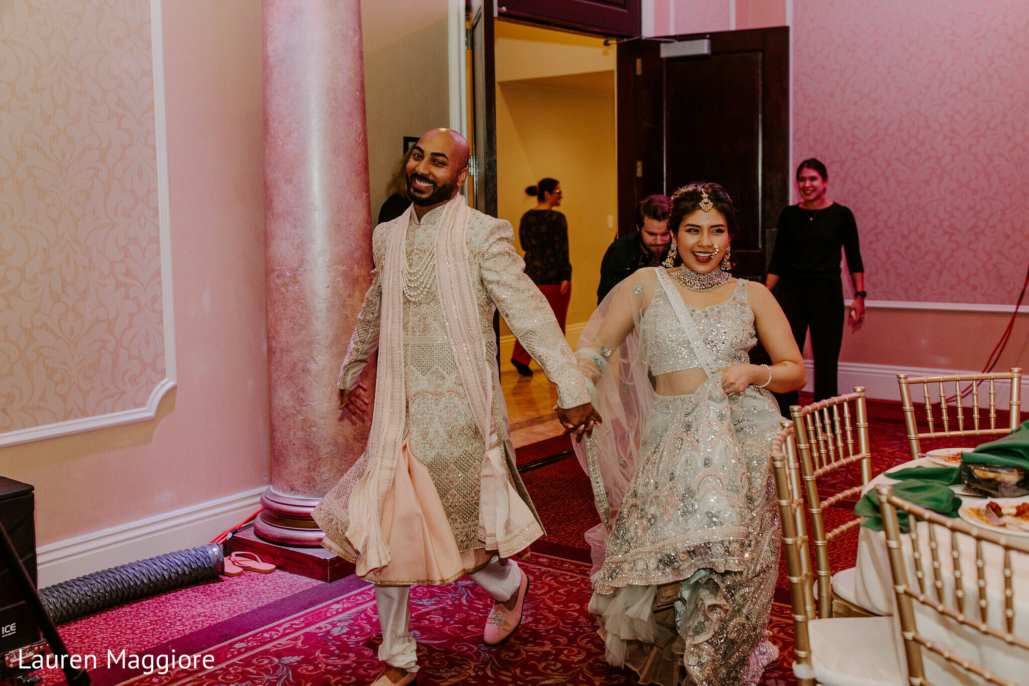 Elegant Indian bride and groom entrance to wedding reception capture ...