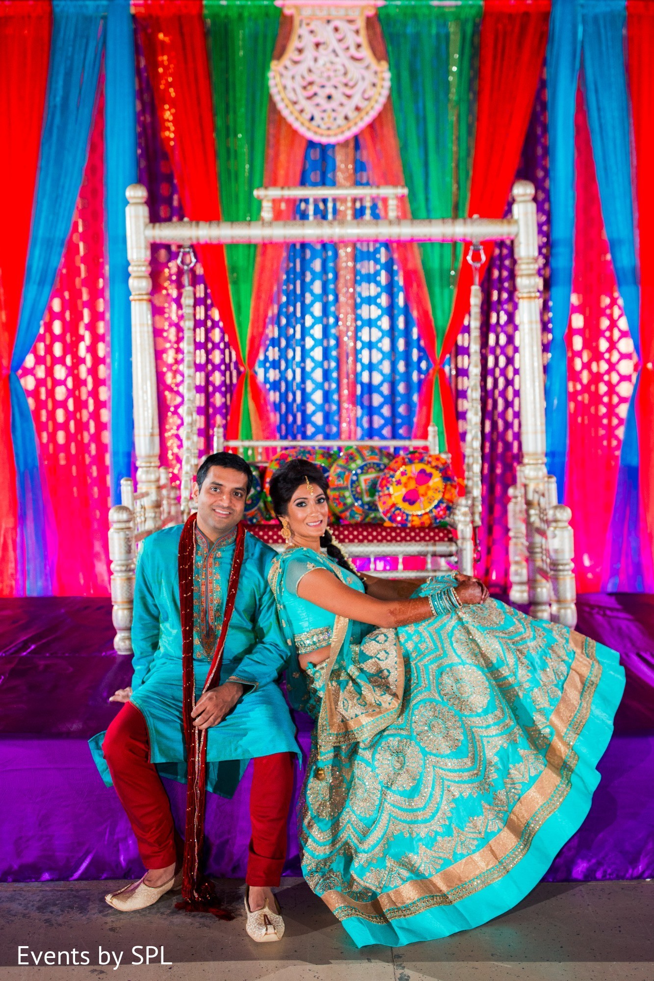 Indian couple posing on the sangeet stage. | Photo 95814